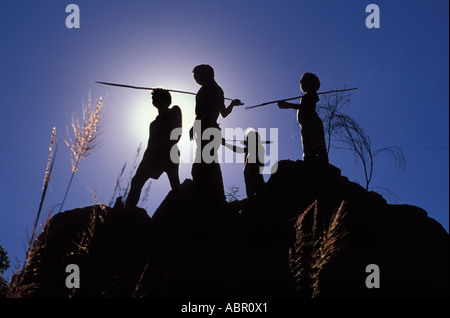 Aboriginal elder and young men hunting with spears in ArnhemLand. Spear ...