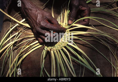 Aboriginal woman weaving a traditional pandanus mat in Arnhem Land ...