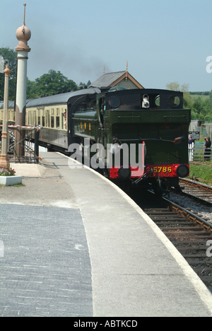 South Western Railway train approaching Wool train station with stop ...