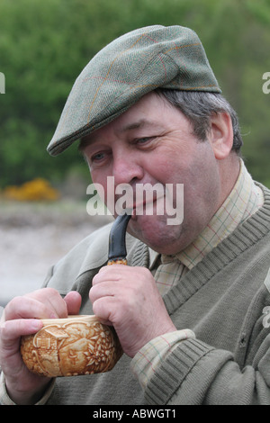 "Fisherman jokes with a pipe shaped ashtray Stock Photo - Alamy