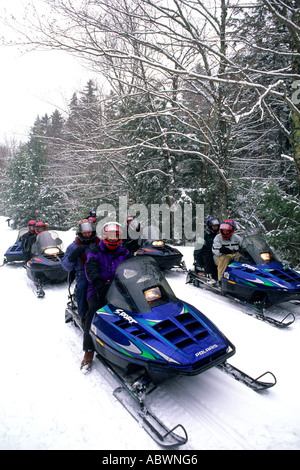 Snow mobiling adventure with riders thru the winter trails in New ...