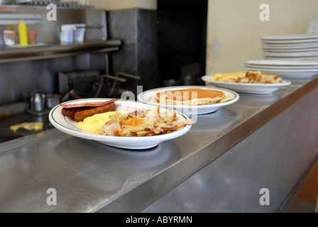 Short order cook prepares food in a small restaurant Stock Photo - Alamy
