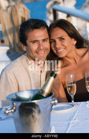 A couple enjoying dinner on the deck of the RMS Queen Mary in Long ...