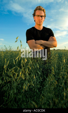 Musician Marcus Eaton at sunset in a field Stock Photo - Alamy
