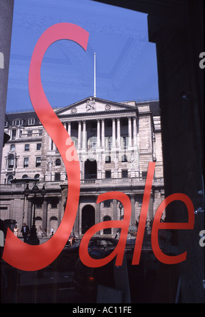 The Bank of England is reflected in a window in the City of London, as ...