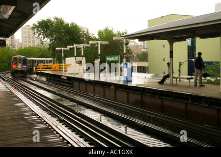 Chicago, Illinois, USA, A Brown Line elevated train makes the tight ...