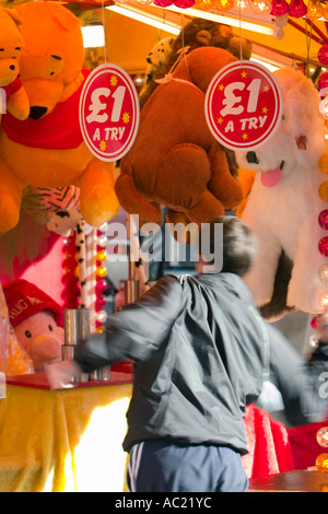 Stack of tins fairground sideshow game Stock Photo - Alamy