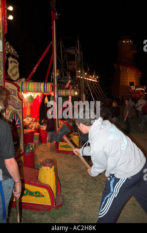 Fairground ring the bell strength test Stock Photo - Alamy