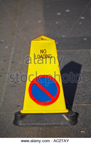 Stop sign on the road of loading on the ferry in the terminal of the ...