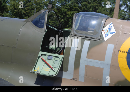 Closeup of a WWll Spitfire fighter showing open canopy and door ...