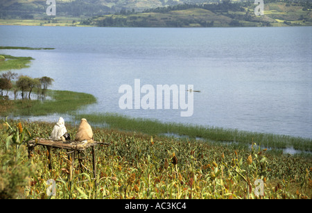 Two watchouts on a platform high above a sorghum field near Lake Hayk ...