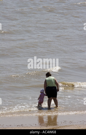 Obese woman wading in water wearing a swimsuit Stock Photo - Alamy