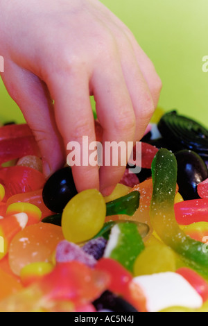 child's hand picking candies Stock Photo - Alamy