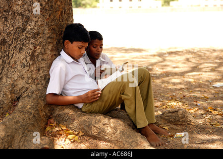 Indian children education under a tree ; open air rural school ...
