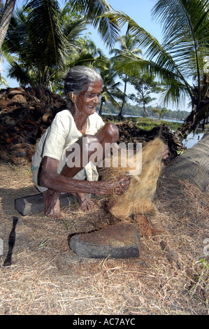 COCONUT FIBRE EXTRACTION IN THE TRADITIONAL WAY BY BEATING THE OUTER ...