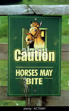 Warning Sign " Caution These animals may bite Stock Photo - Alamy