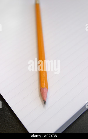 Pencil and Paper. Blank note pad awaiting ideas Stock Photo - Alamy