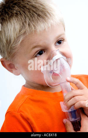 Boy using breathing machine Stock Photo - Alamy