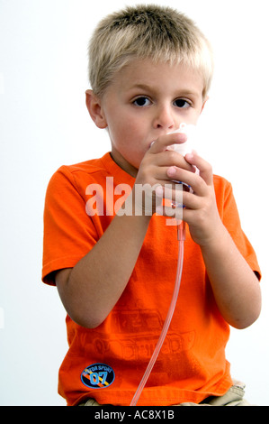Boy using breathing machine Stock Photo - Alamy