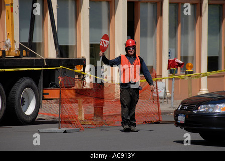 Directing traffic, stop sign Stock Photo - Alamy