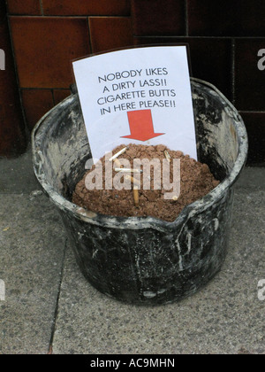 Sand bucket for cigarette butts Stock Photo - Alamy