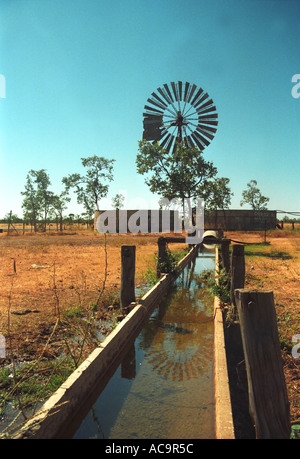 Farm Windmill and water trough Stock Photo - Alamy