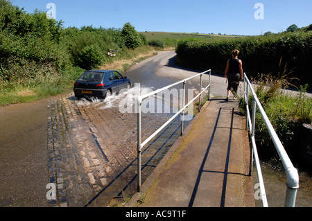 A ford river crossing at a road in the Piddlevalley in Dorset England ...