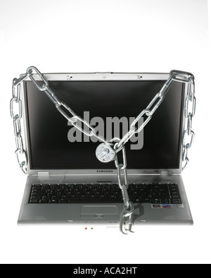 Laptop with chains Stock Photo - Alamy