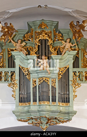 Carved wooden angels play musical instruments beneath the soaring ...