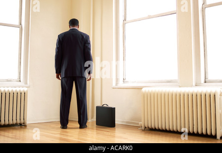 Man facing wall Stock Photo - Alamy
