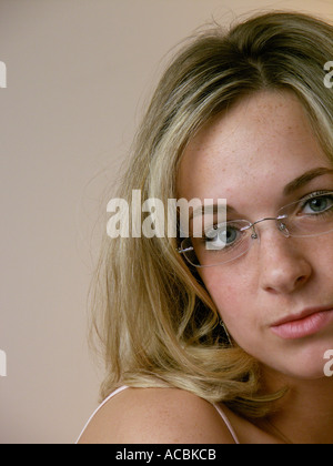 Portrait of a young teenager with a coy stare Stock Photo - Alamy