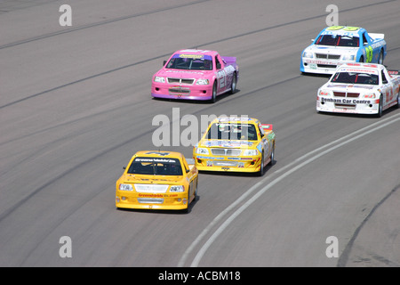 Racing pick up trucks racing around a banked circuit Stock Photo - Alamy