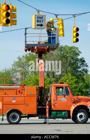 Maintenance crew works to restore fix and refurbish a street traffic ...