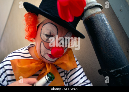 Clown with bottle Stock Photo - Alamy
