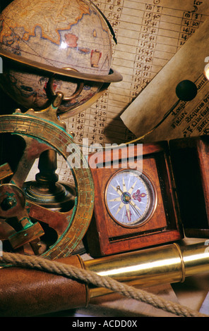 Vintage tools of navigation and cartography with an antique globe and ...