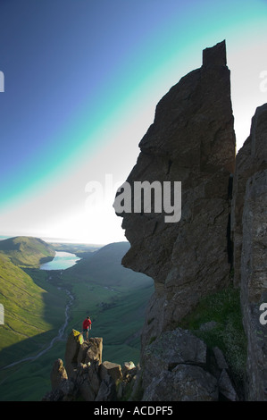 a climber below the Sphinx rock on Great Gable with Wasdale valley and ...