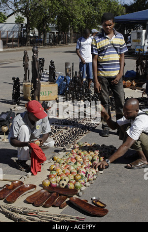 Maputo craft market selling wooden beer bottle as tourists souvenirs ...