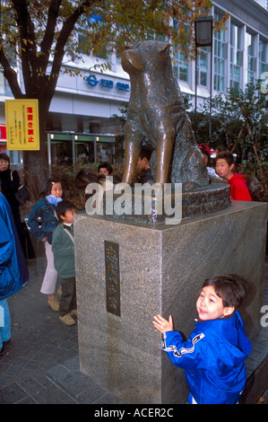 Bronze statue of Hachiko in front of train station of Shibuya, Tokyo ...