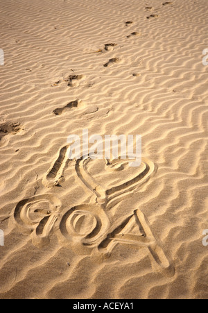 The Words Enjoy Goa Written in the Sand on a Beach Stock Photo ...