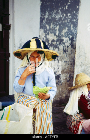AFRICA MOROCCO TANGIER Berber woman in traditional dress selling ...