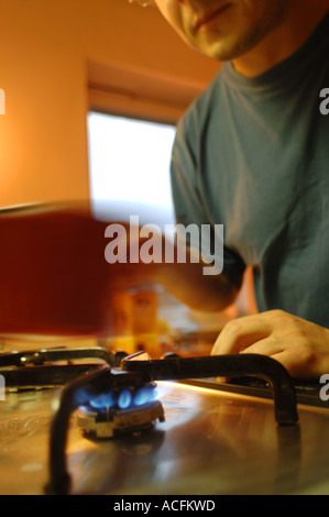Cooking, flame and man with hands, home and frying pan with fire ...