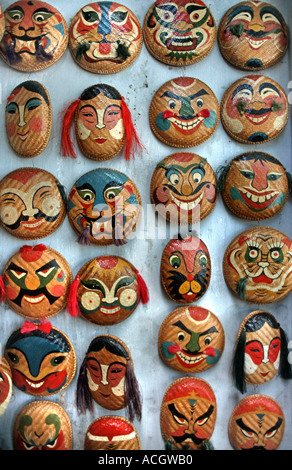 Selection of colourful hand painted Vietnamese masks for sale on a ...
