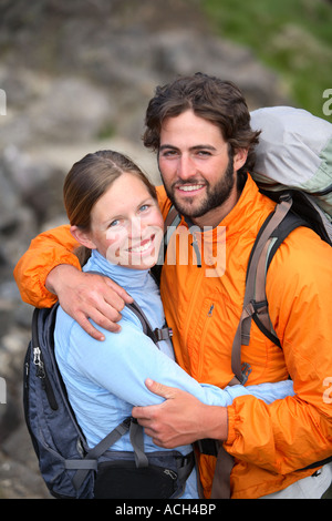 Backpacking couple pose for a portrait Stock Photo - Alamy