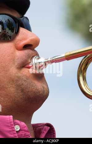 man blowing trumpet Stock Photo - Alamy
