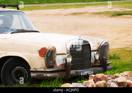 Mercedes star, old rusty Mercedes classic car, Yangon, Burma also known ...