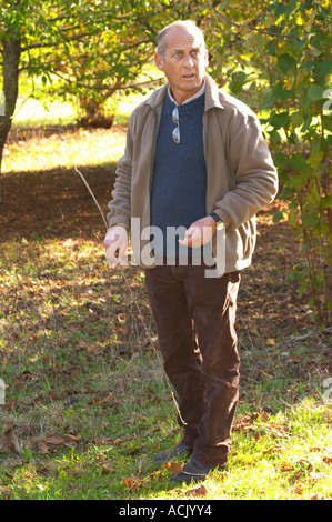 Hugues Martin, the owner of the truffles farm showing how you use a ...