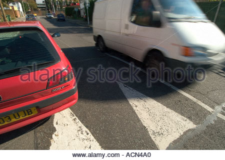 A car going over a speed hump Stock Photo: 15897928 - Alamy