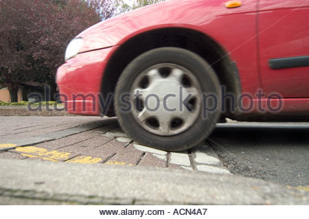 Car going over Speed bump / Sleeping policeman, France Stock Photo ...