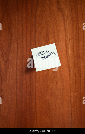well done written on a post it note memo Stock Photo - Alamy
