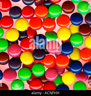 "Smarties" red, green, blue, orange, yellow and purple sweets on a ...